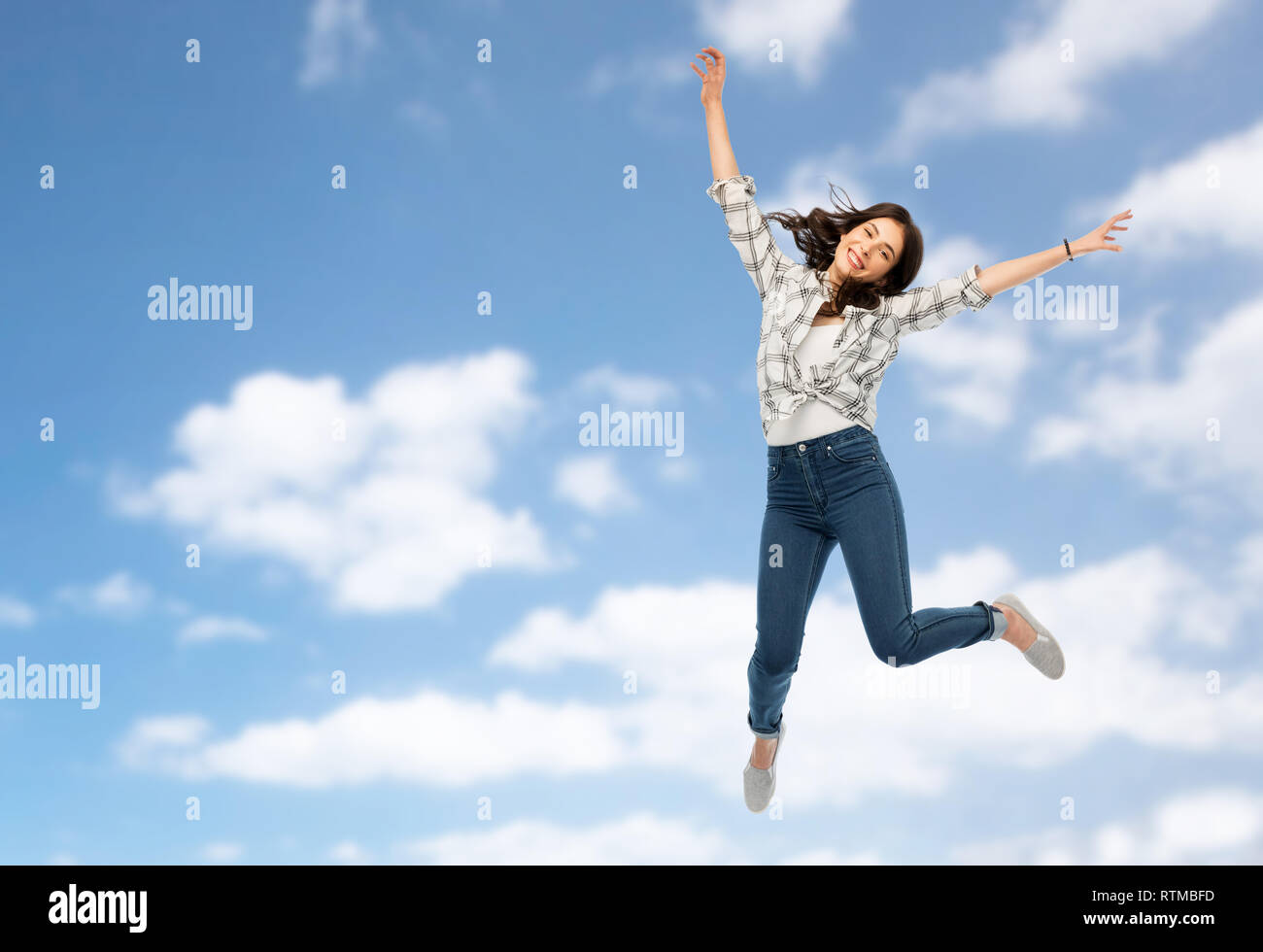 happy young woman or teenage girl jumping Stock Photo - Alamy