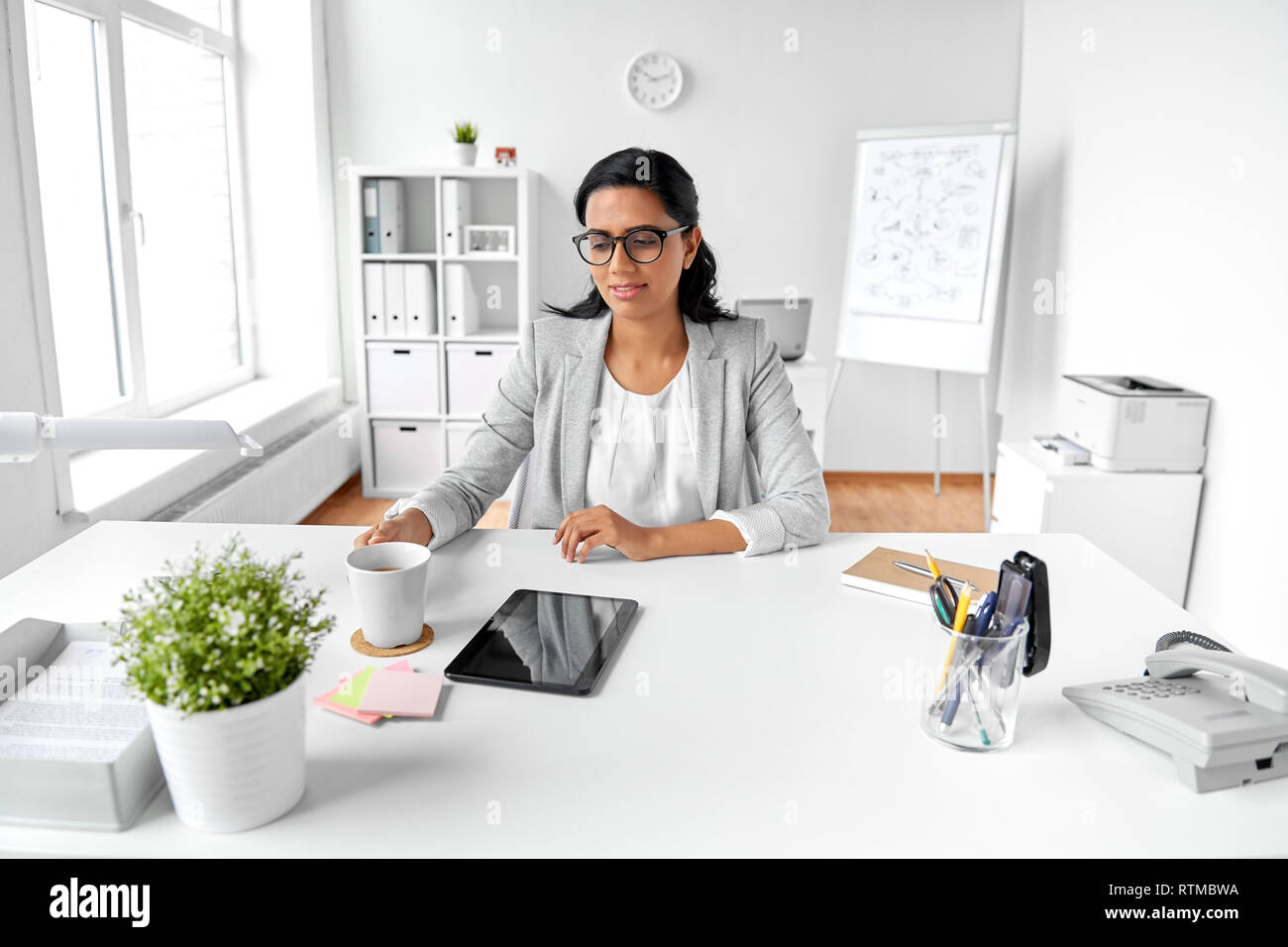 Indian woman drinking tea hi-res stock photography and images - Alamy