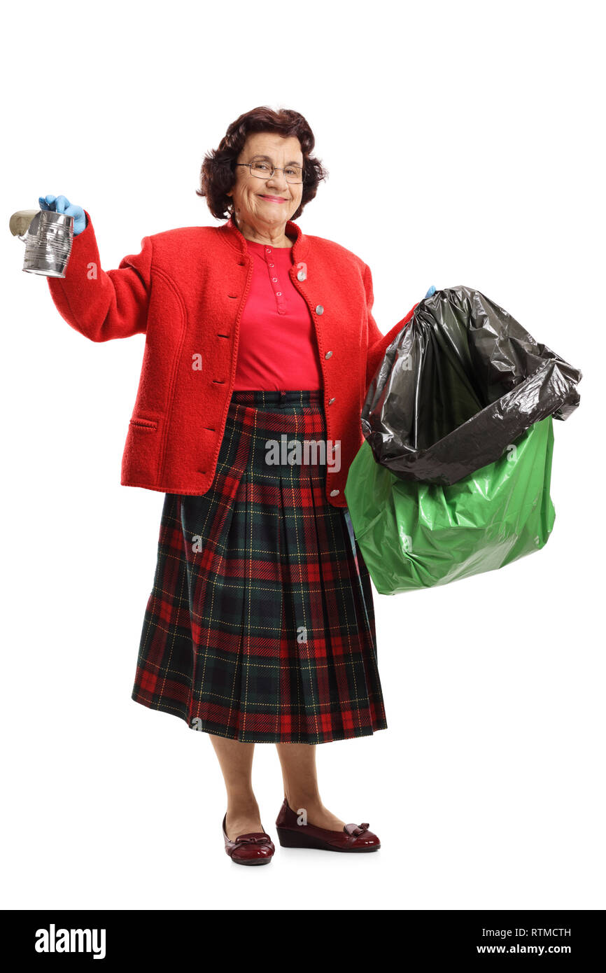 Full length portrait of an elderly woman recycling with a tin can and a ...