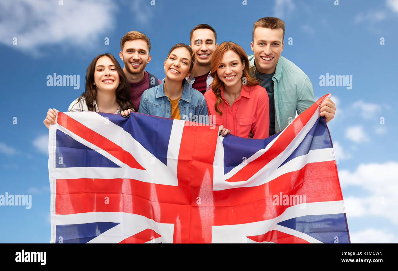 group of smiling friends with british flag Stock Photo - Alamy
