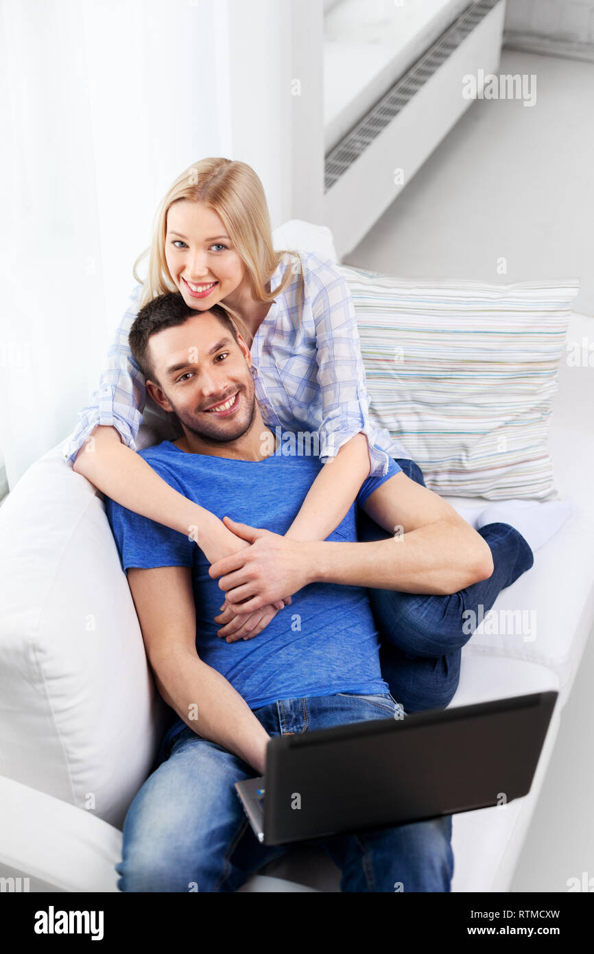 happy couple with laptop computer at home Stock Photo - Alamy