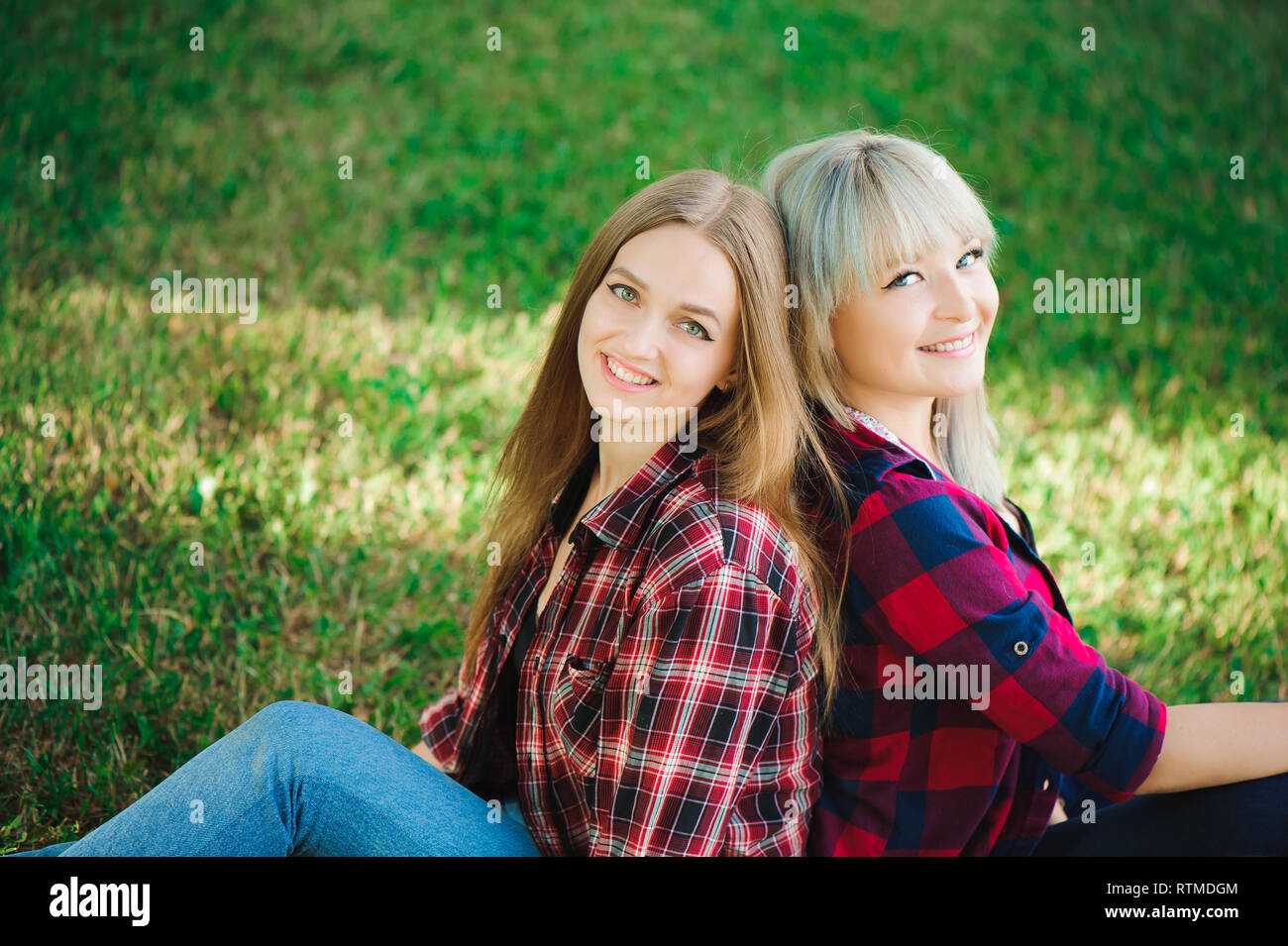 Two friends smiling outside. Lifestyle and people concept Stock Photo ...