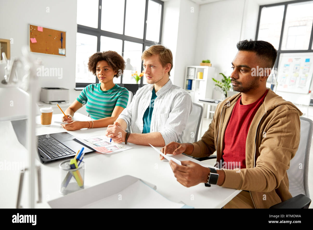 happy creative workers with laptops at office Stock Photo - Alamy