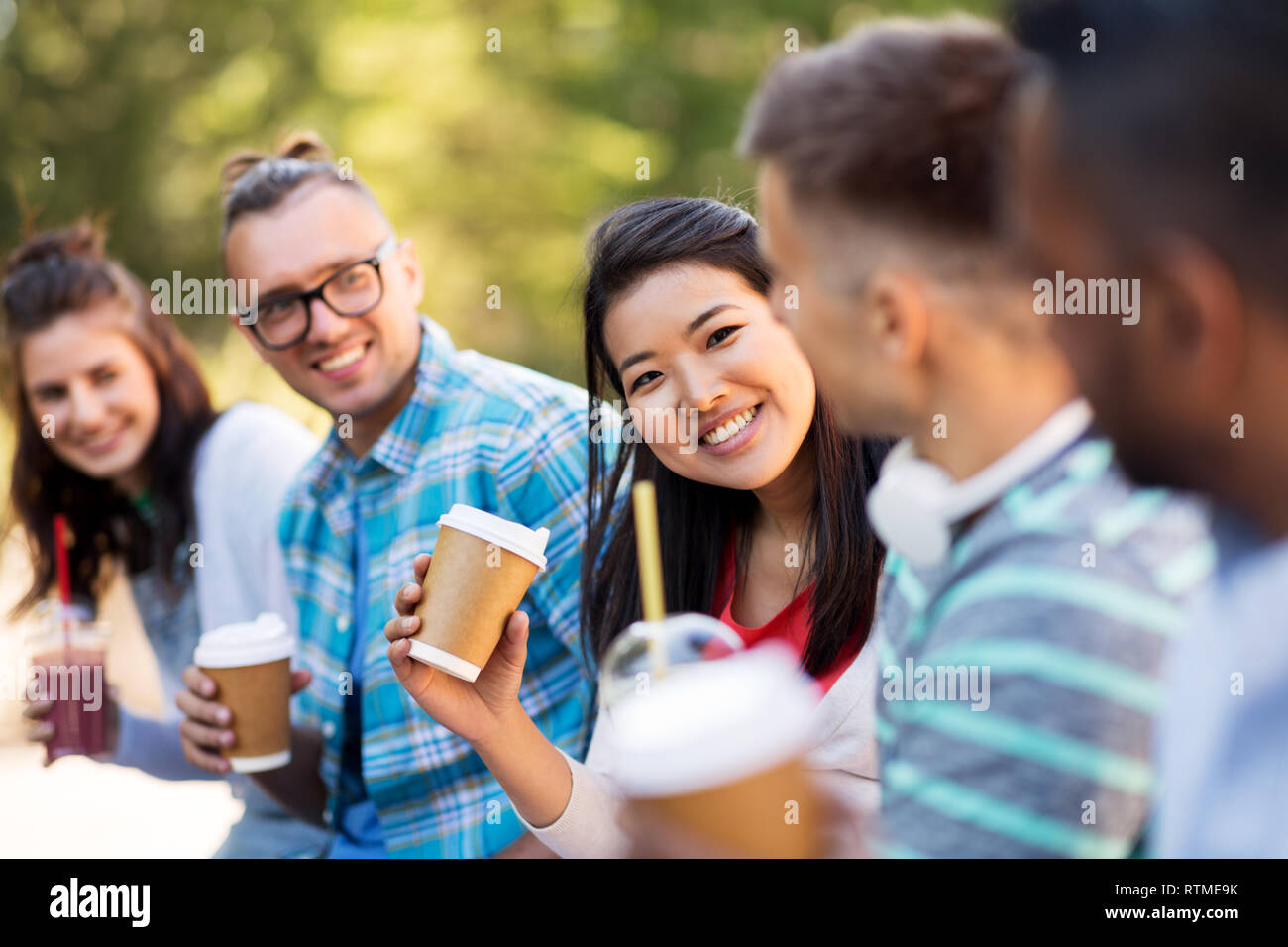 Friends drinking coffee juice talking hi-res stock photography and ...