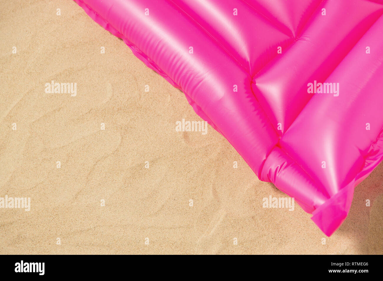 pink swimming mattress on beach Stock Photo - Alamy