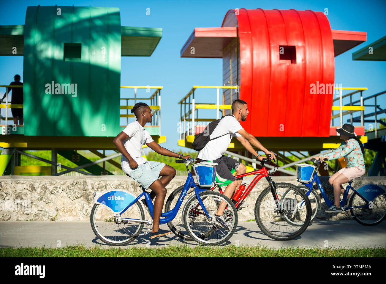 MIAMI - JULY 2017: Tourists using CitiBike bicycle share system ride ...