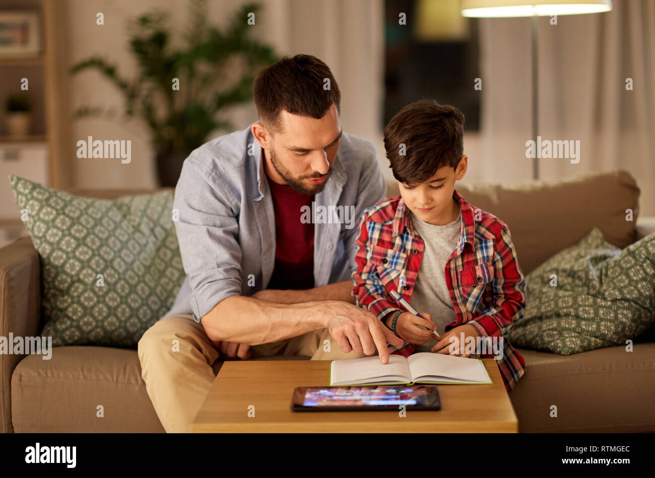 father and son doing homework together Stock Photo - Alamy