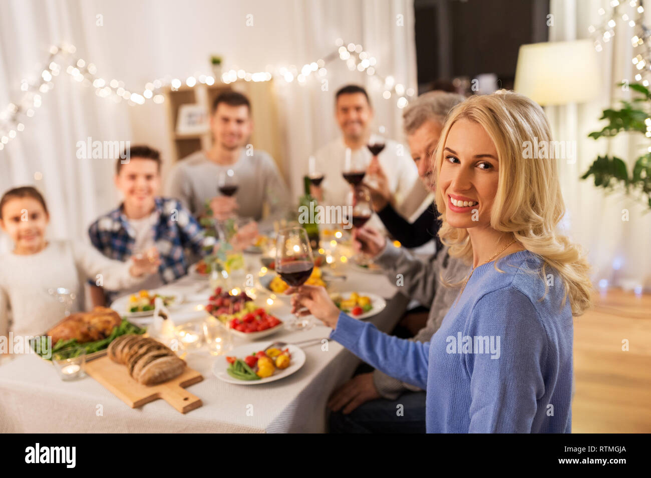 happy family having dinner party at home Stock Photo - Alamy