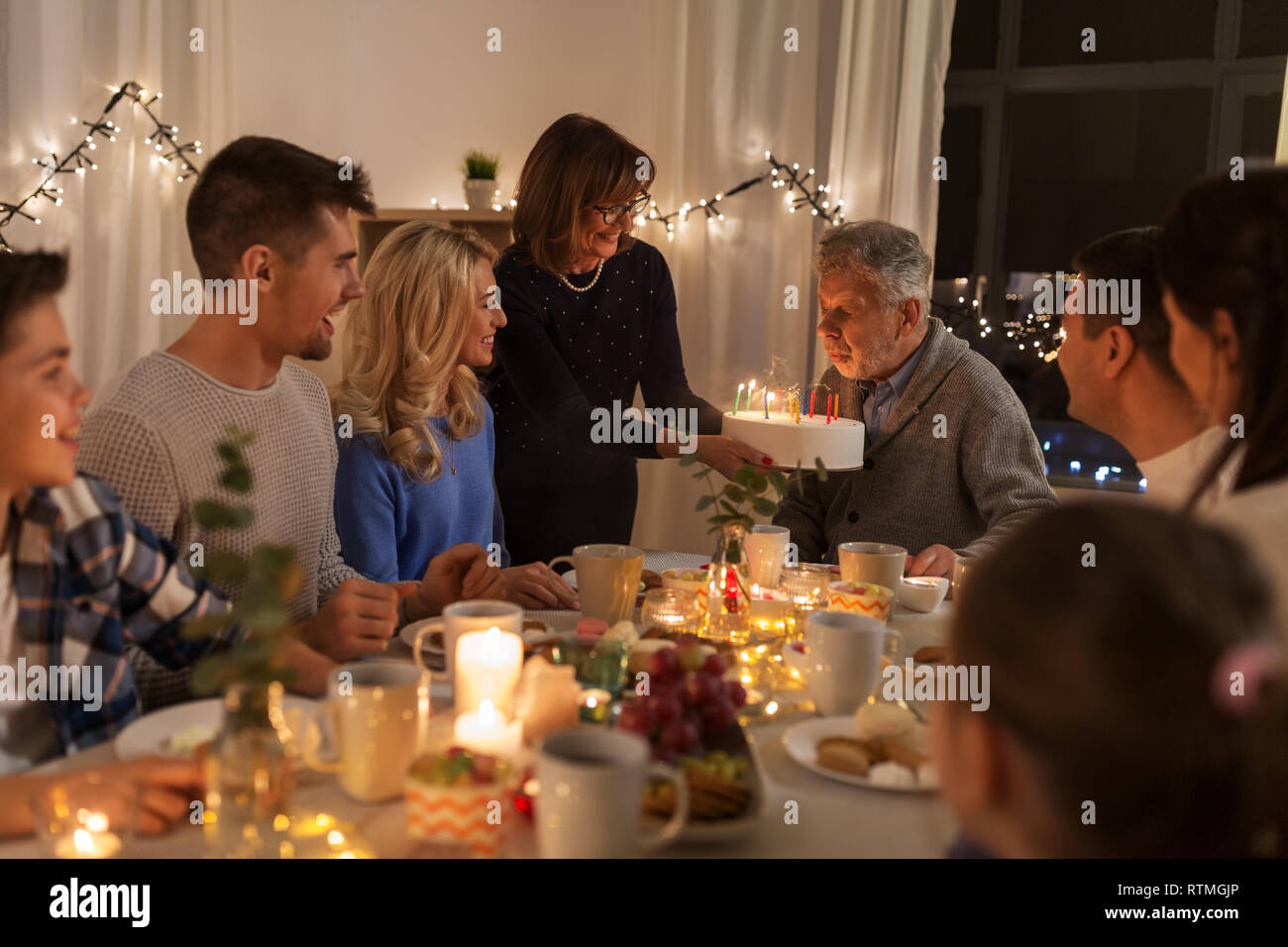 happy family having birthday party at home Stock Photo - Alamy