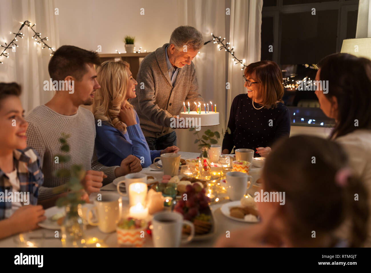 happy family having birthday party at home Stock Photo - Alamy