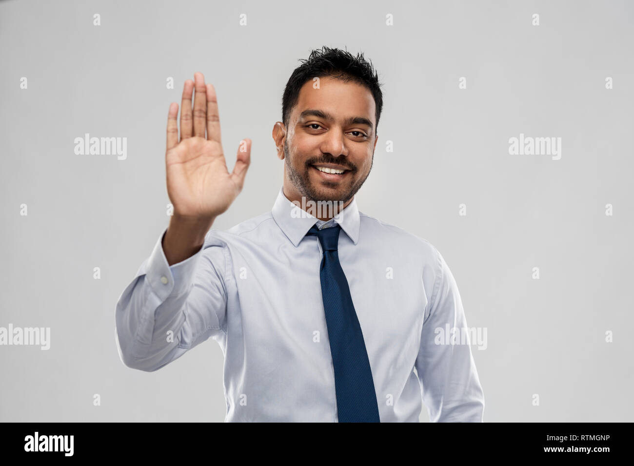 indian businessman making high five gesture Stock Photo - Alamy