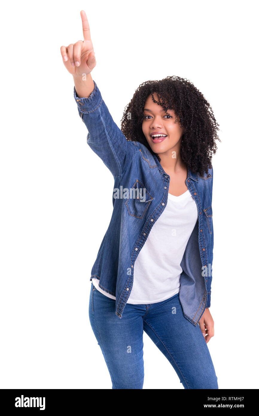 A beautiful african woman pointing to something, isolated over a white ...