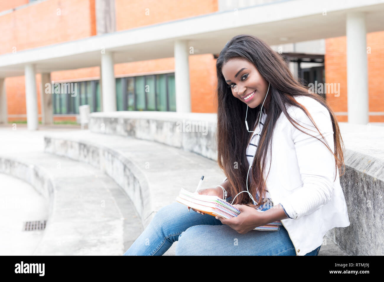 Happy african young student at the university campus Stock Photo - Alamy