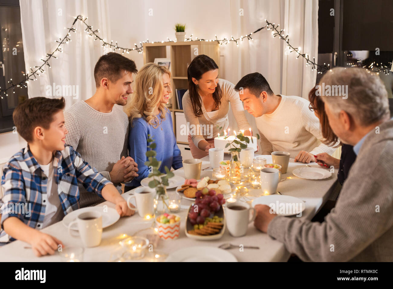 happy family having birthday party at home Stock Photo - Alamy