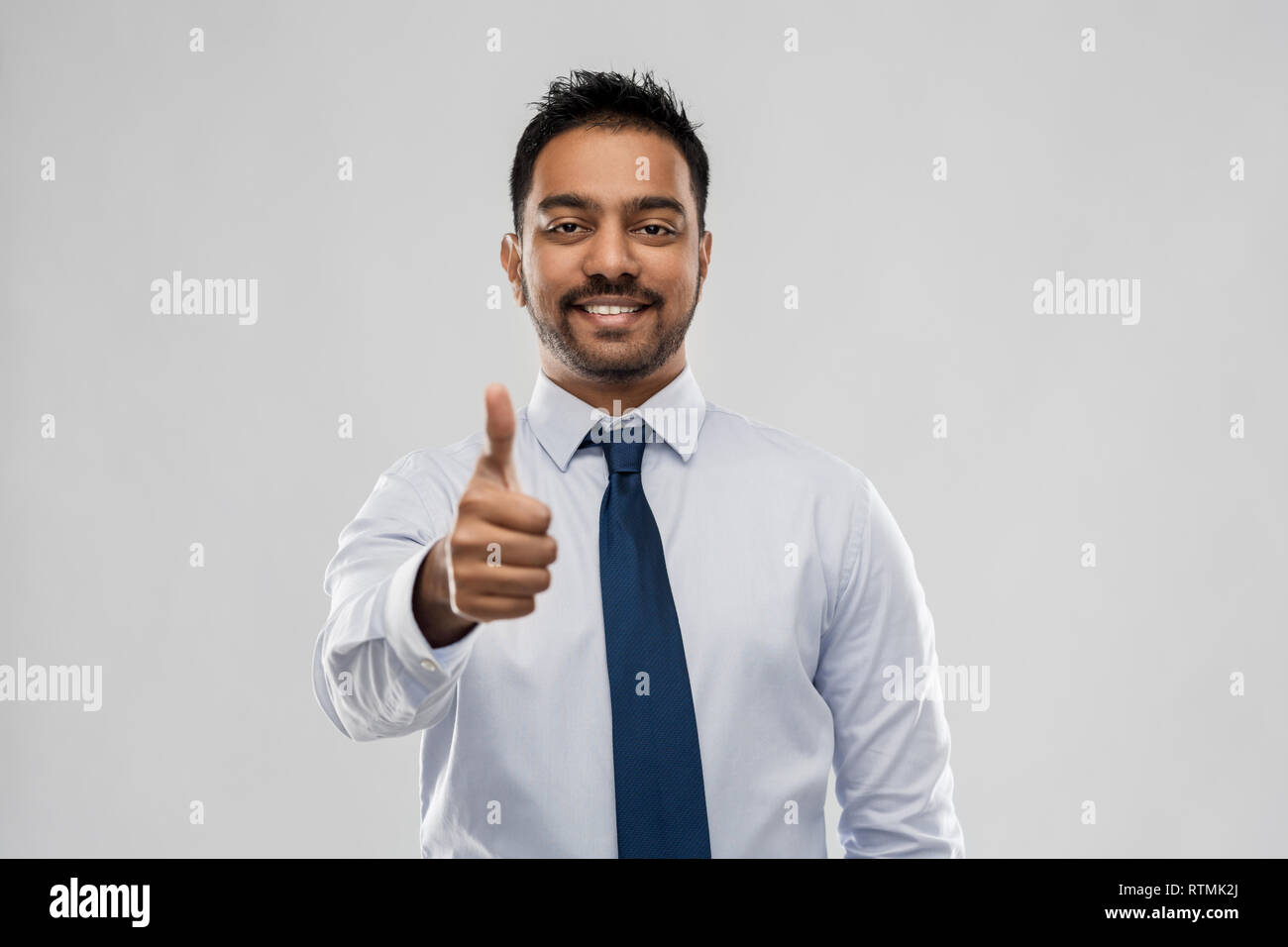 indian businessman showing thumbs up Stock Photo - Alamy