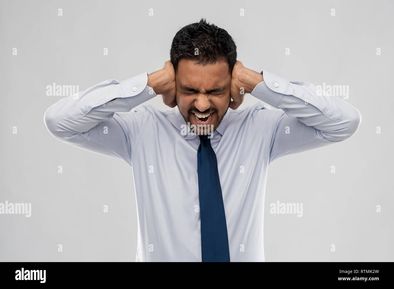 Covering ear hi-res stock photography and images - Alamy