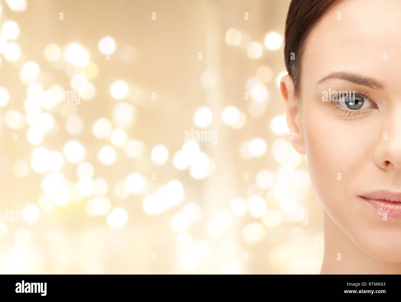 half face of young woman over lights background Stock Photo - Alamy