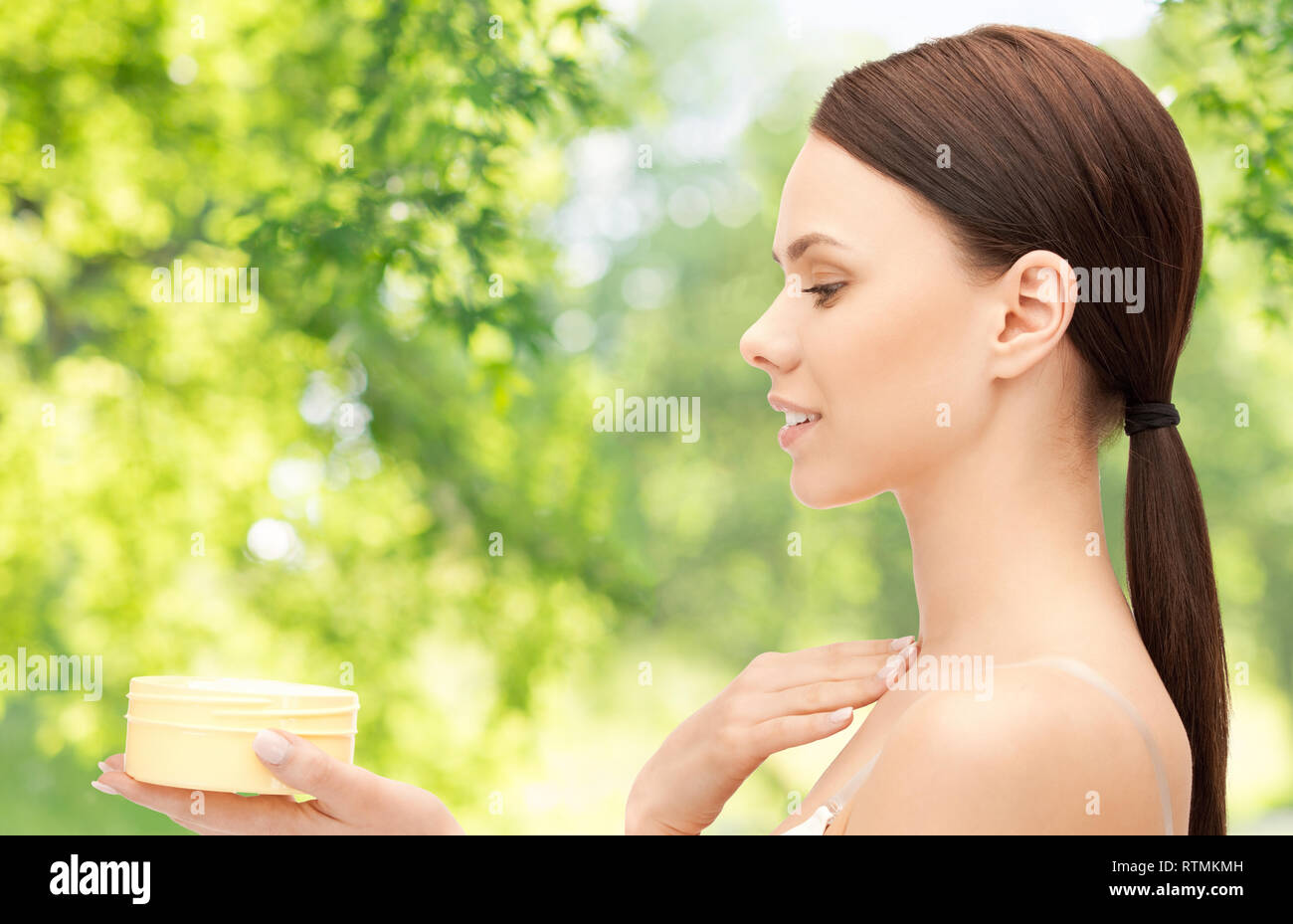 beautiful woman with moisturizing cream Stock Photo - Alamy