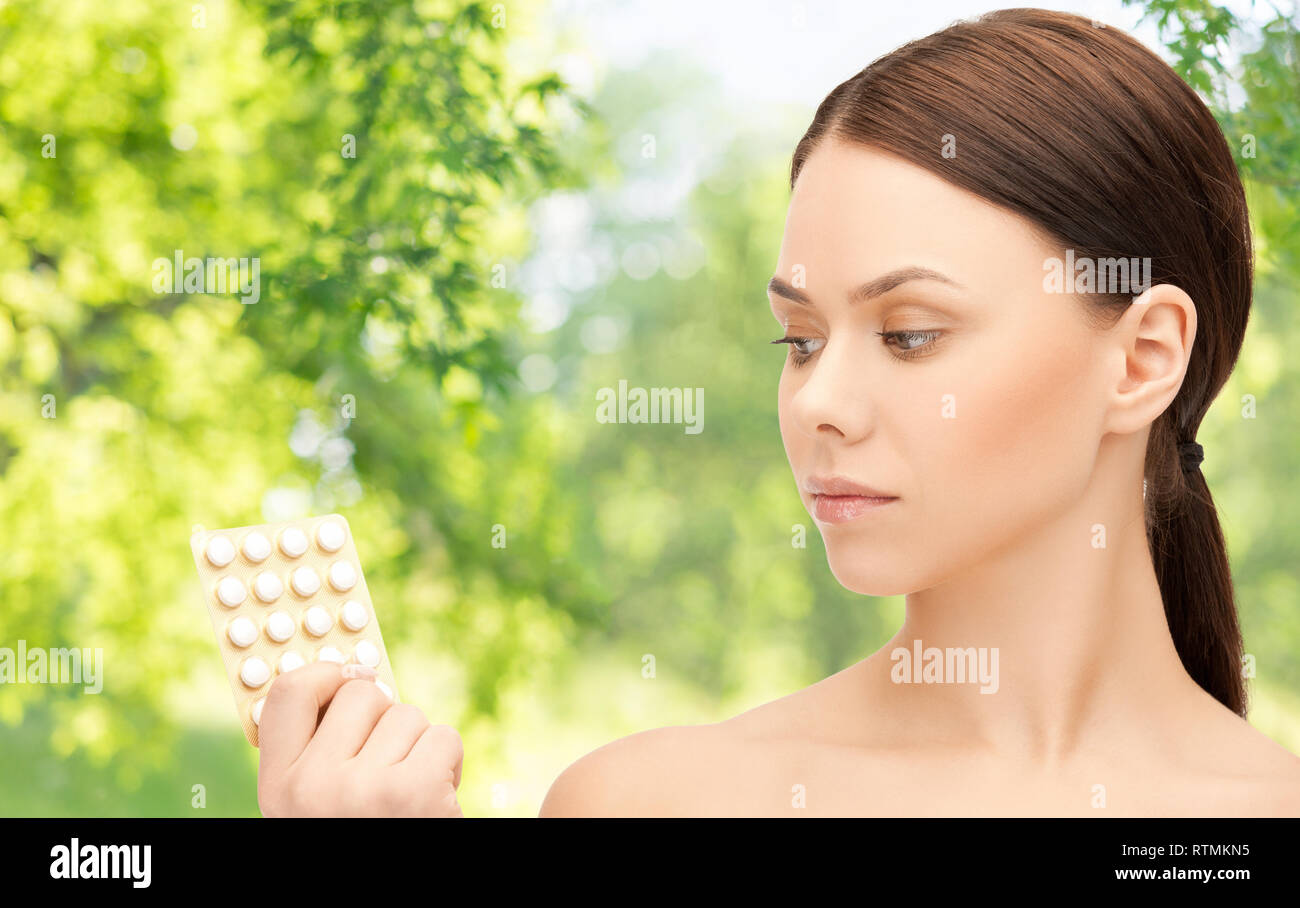 young woman with pills Stock Photo - Alamy