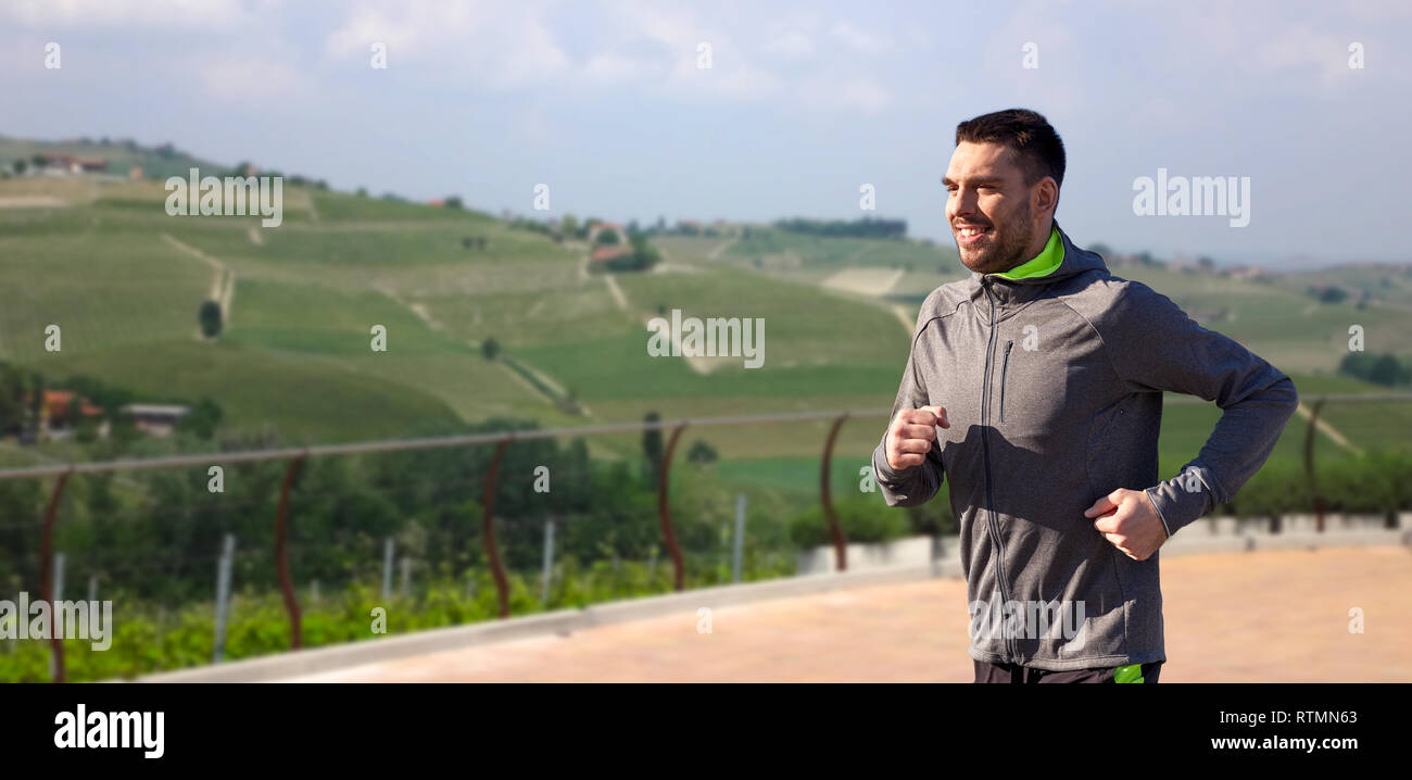 Young happy man running hi-res stock photography and images - Alamy