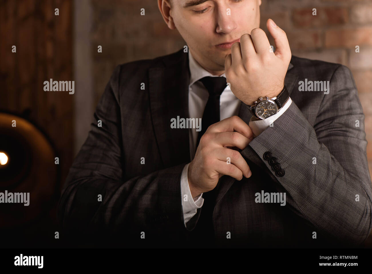 Man correcting sleeve hi-res stock photography and images - Alamy