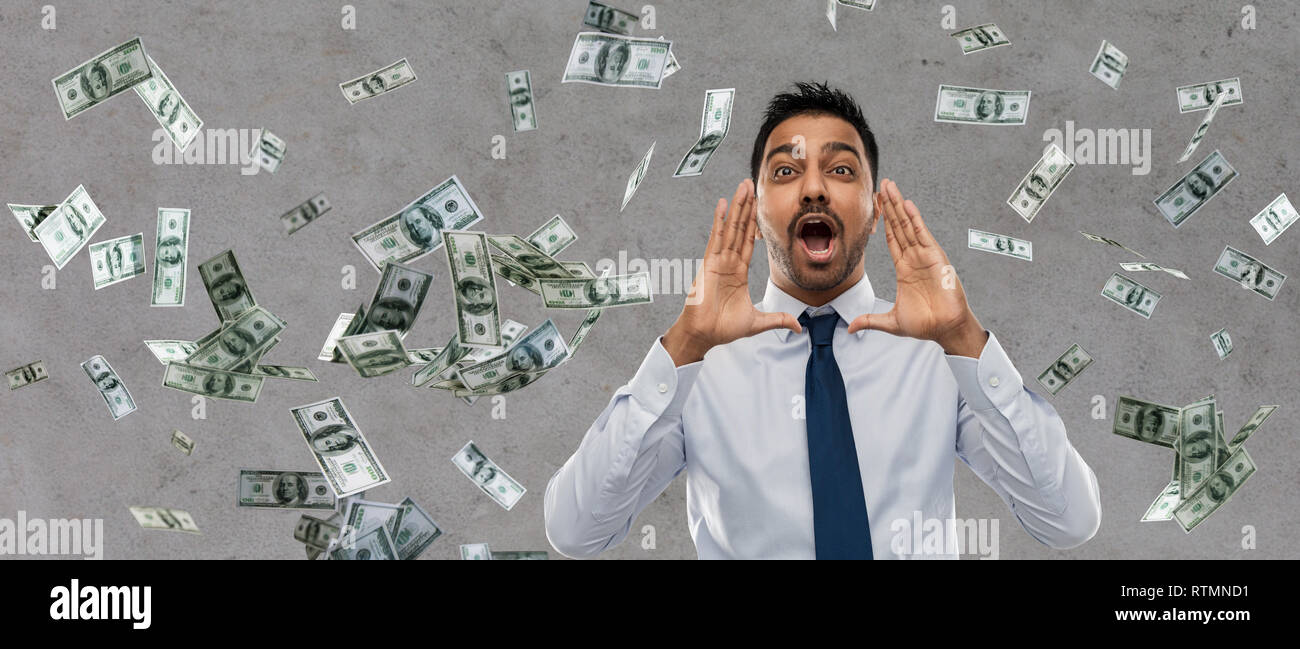 indian businessman shouting over money rain Stock Photo - Alamy