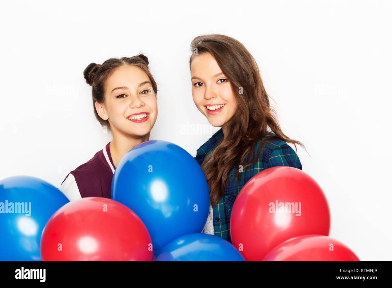 happy teenage girls with helium balloons Stock Photo - Alamy