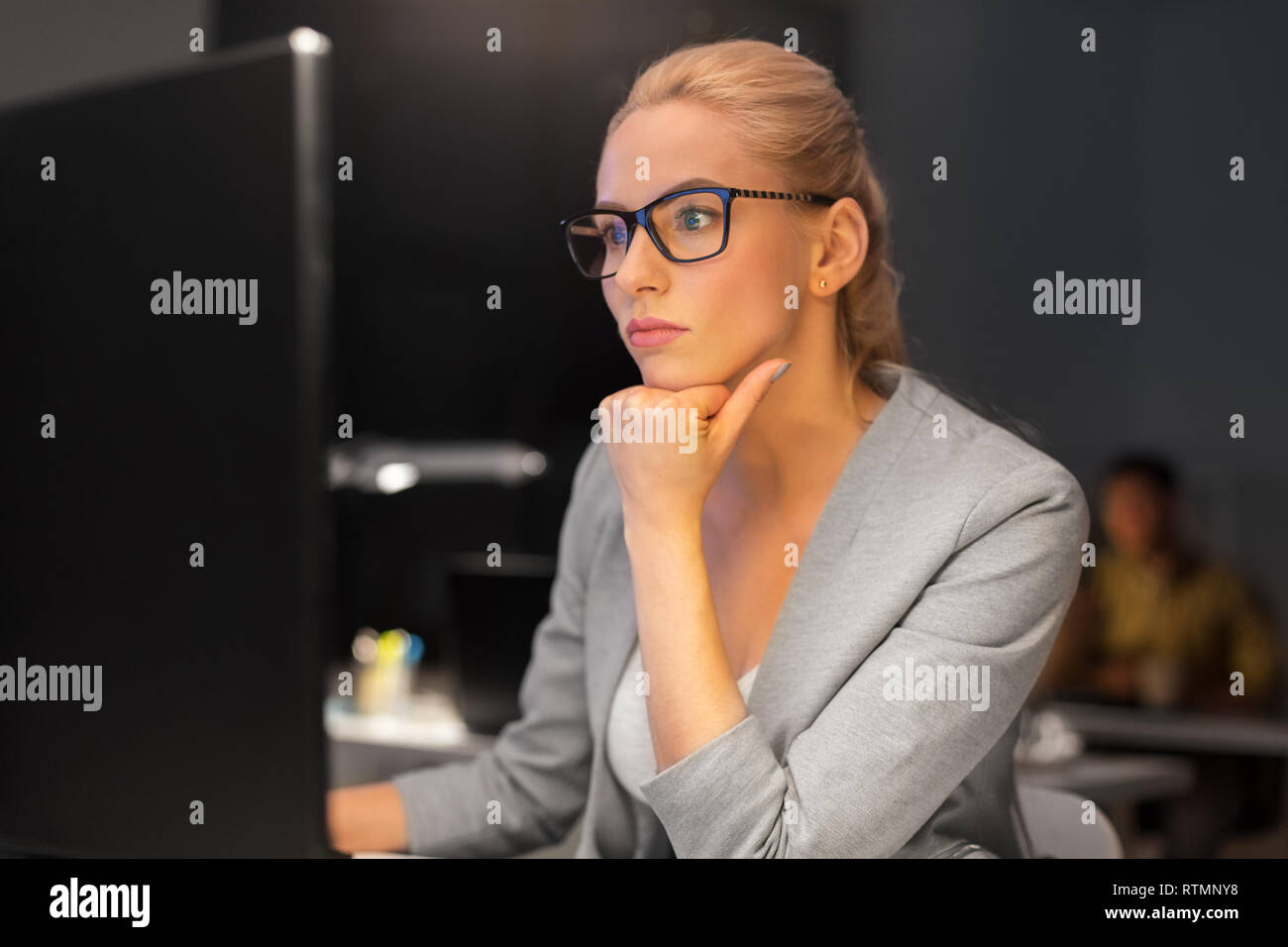 Woman working late in dark office hi-res stock photography and images ...