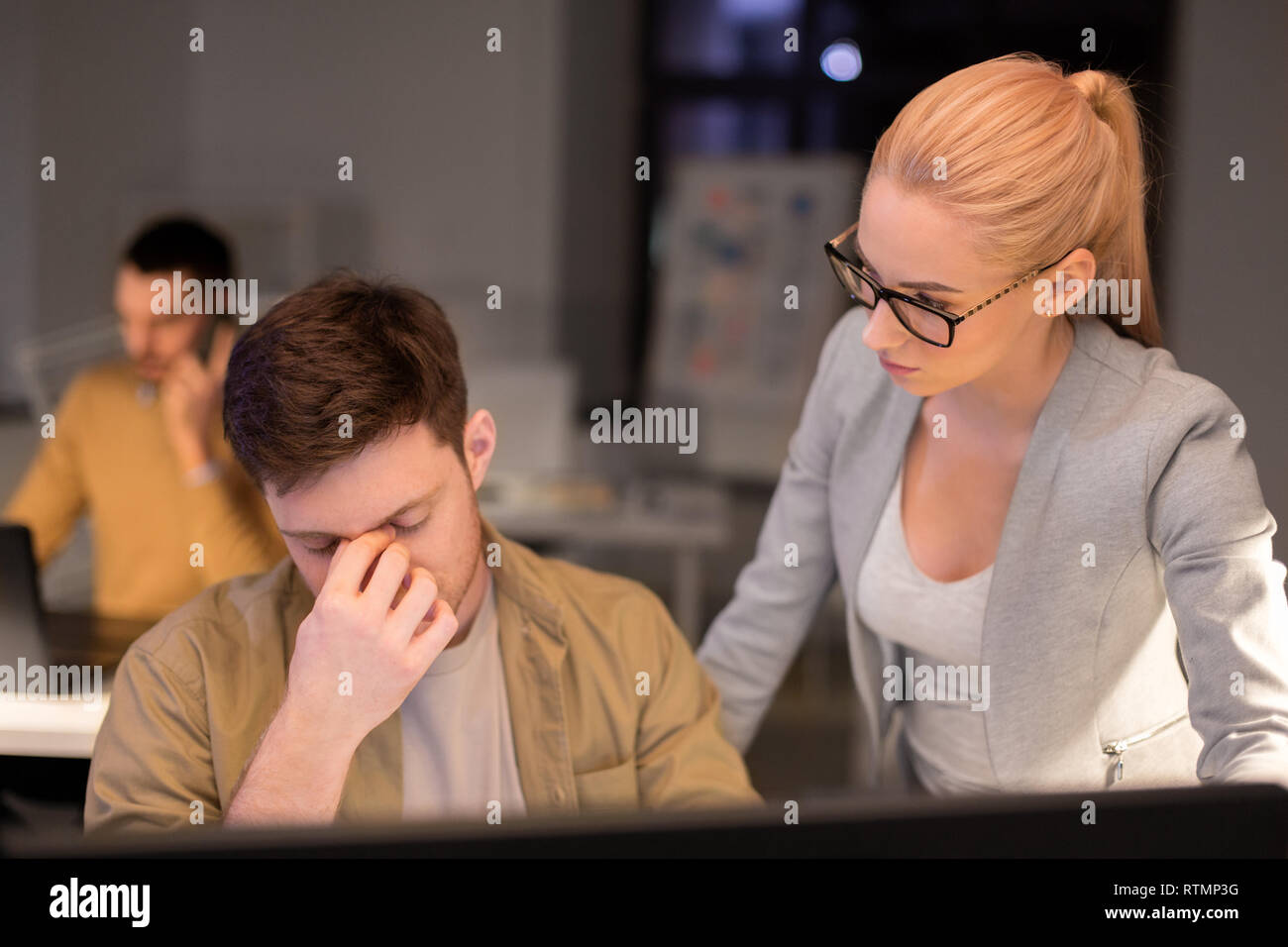 business team with computer working late at office Stock Photo - Alamy