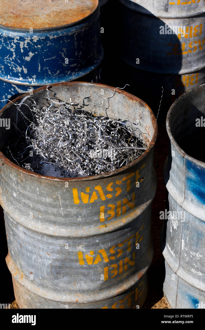 Metal waste bin storage area outside engineering works awaiting ...