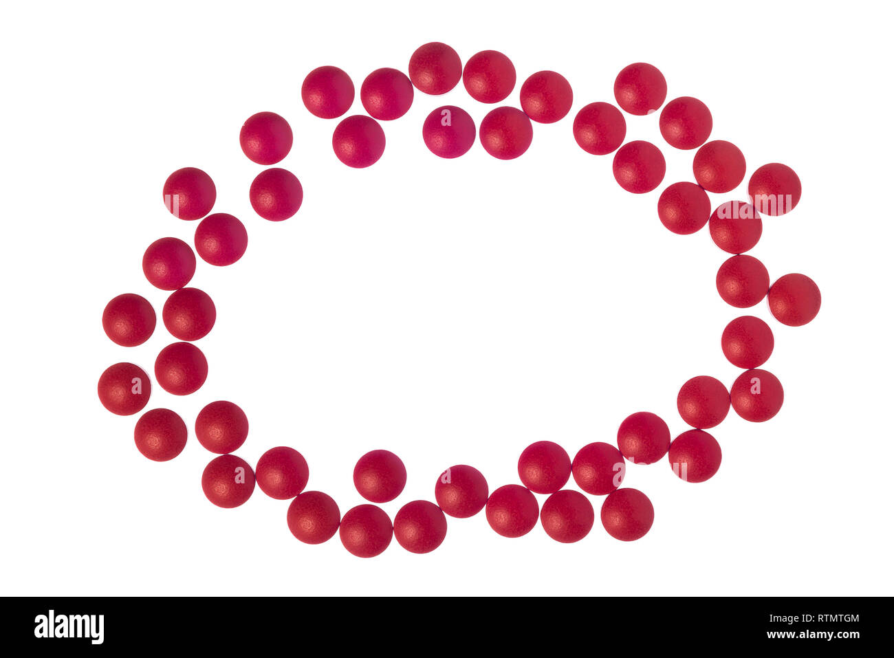 Horizontal close-up shot of red pain relief tablets in a circular ...