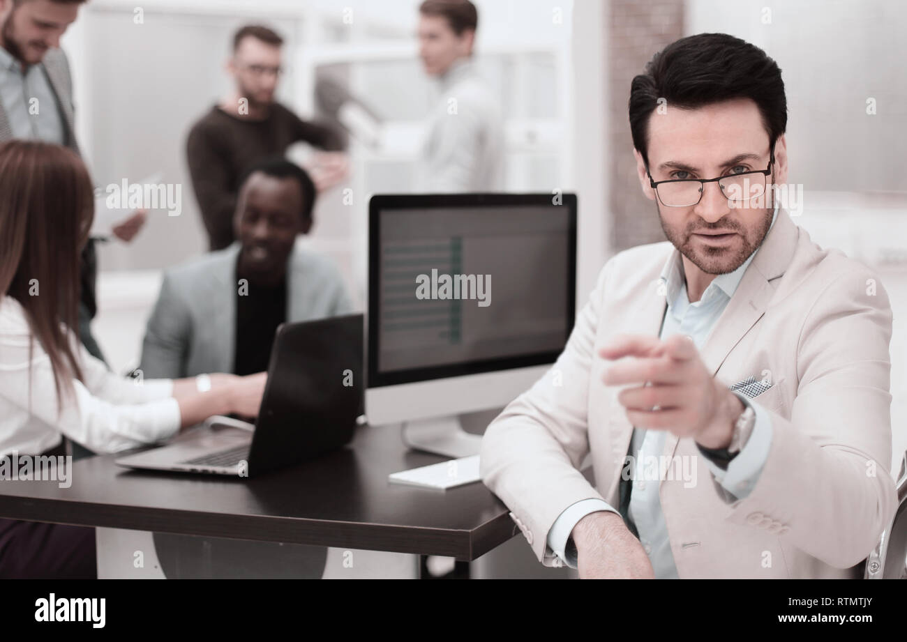 Manager sitting at the office Desk Stock Photo - Alamy