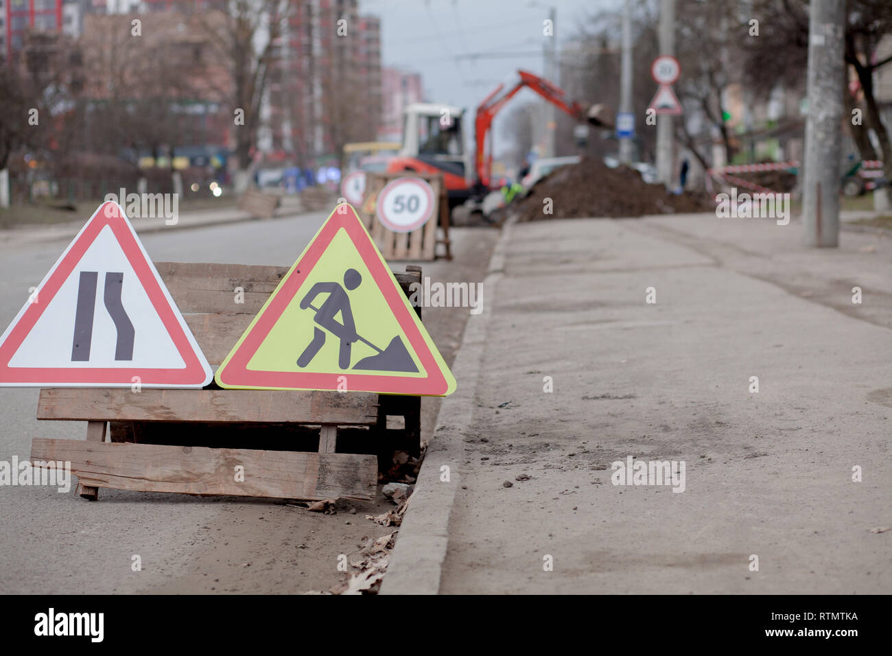 Road signs, detour, road repair on street background, truck and ...