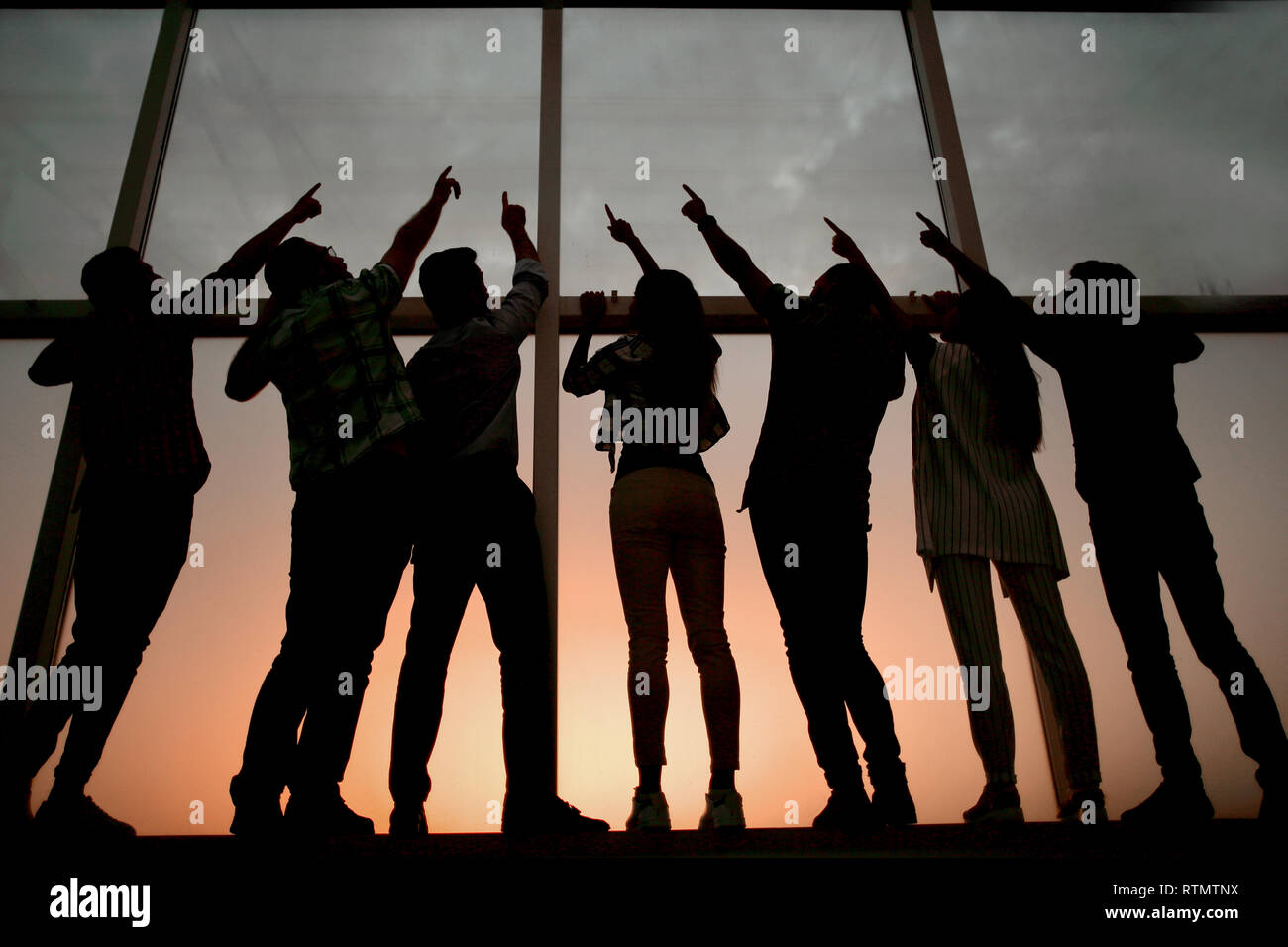 in full growth. business team pointing up Stock Photo - Alamy