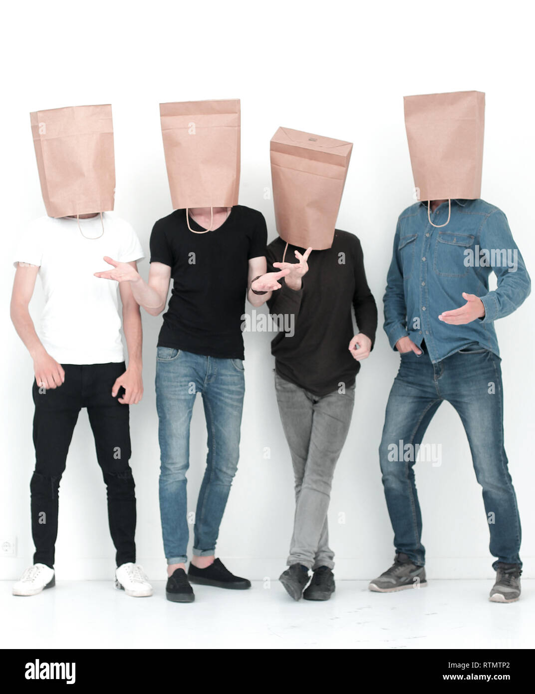 group of young people with paper bags on their heads Stock Photo - Alamy