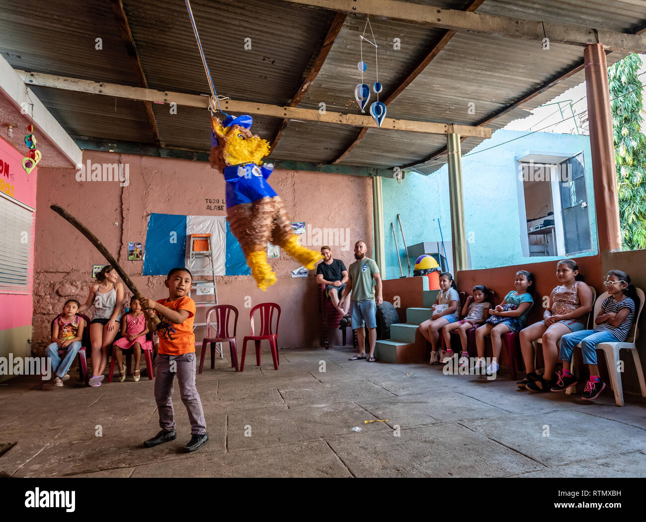 young latin boy swinging at pinata at Guatemalan birthday party Stock ...