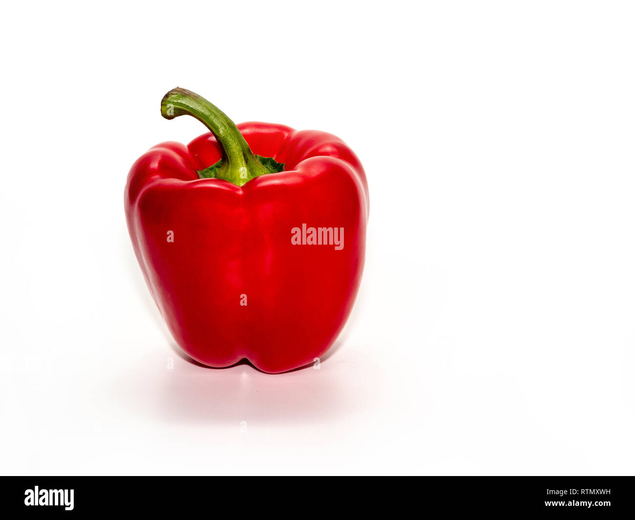 A red paprika on a white background, isolated Stock Photo - Alamy