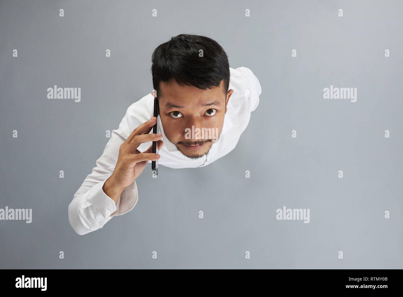 Handsome asian businessman talking hi-res stock photography and images ...