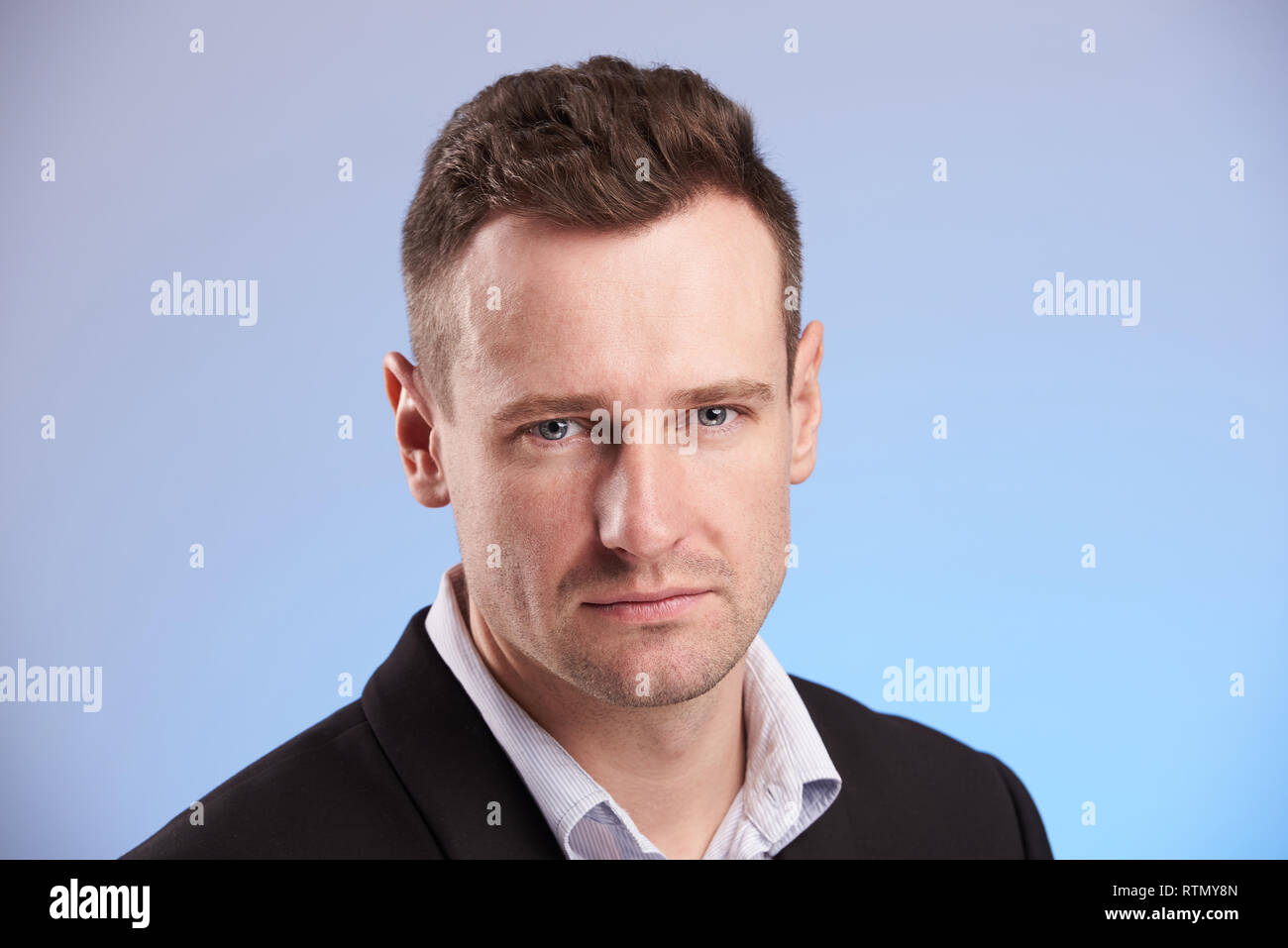 Serious handsome young man hi-res stock photography and images - Alamy