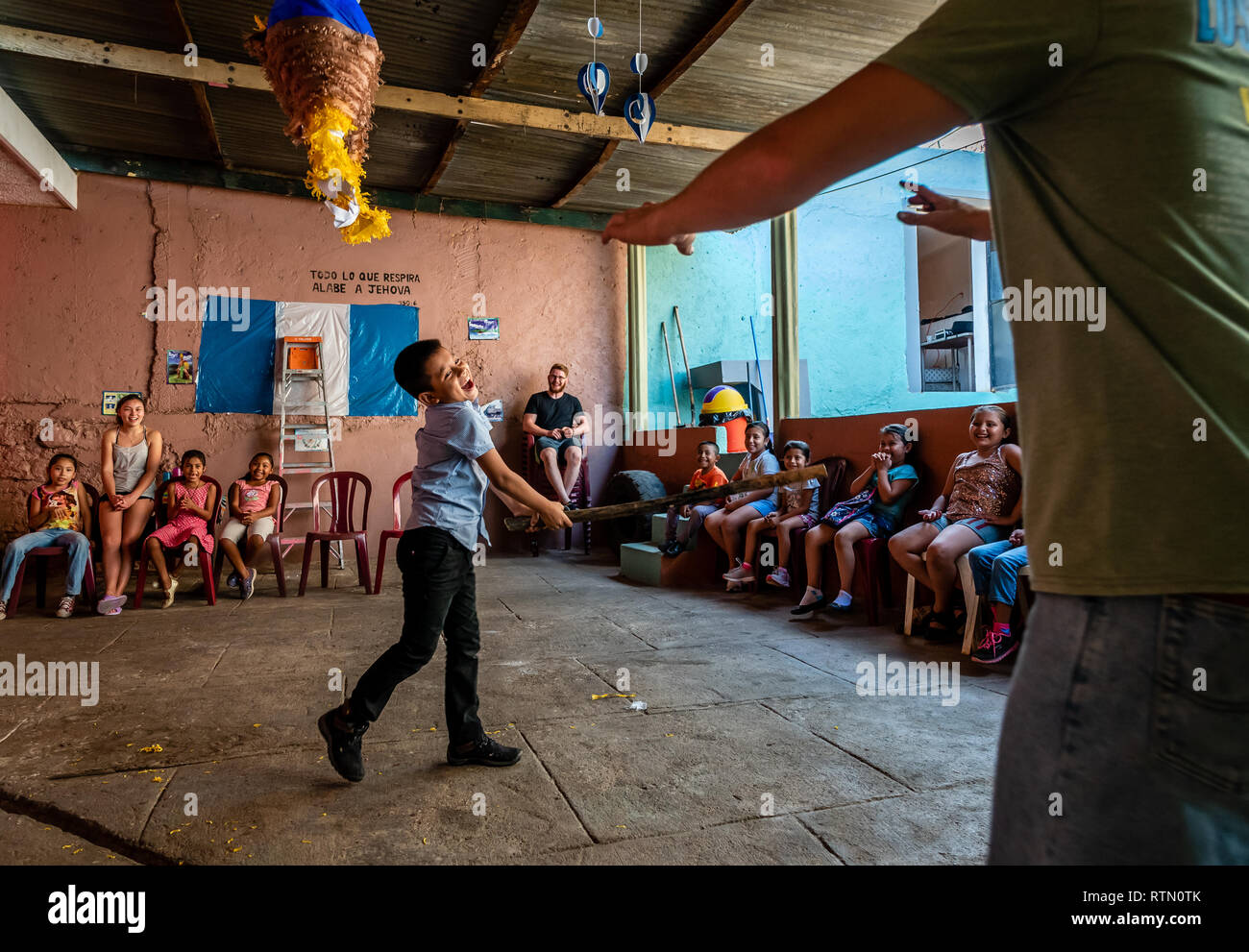 young latin boy swinging at pinata at Guatemalan birthday party Stock ...