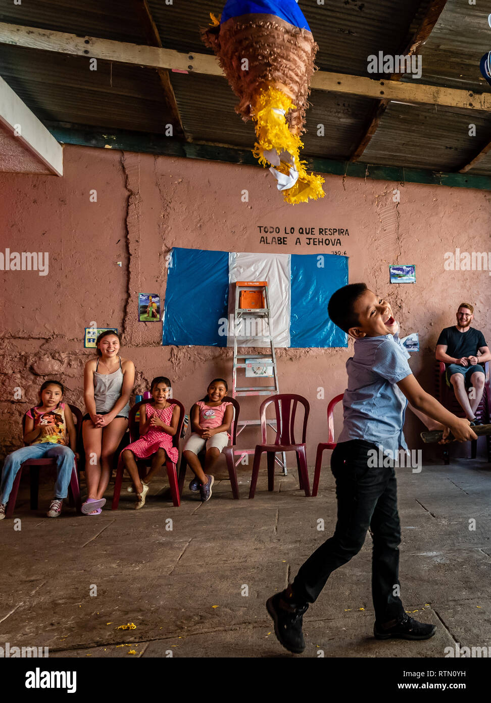young latin boy swinging at pinata at Guatemalan birthday party Stock ...