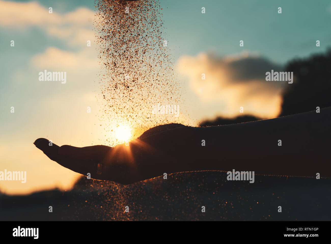 Hand Pouring Sand High Resolution Stock Photography and Images - Alamy