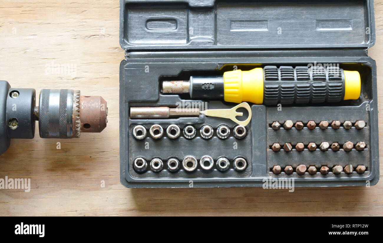 electric drill and variety size of bit in black plastic box Stock Photo ...