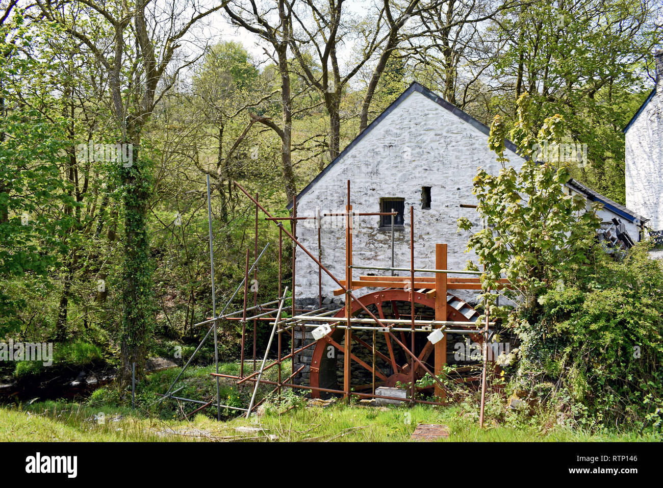 A old white mill being renovated in the Welsh countryside Stock Photo ...