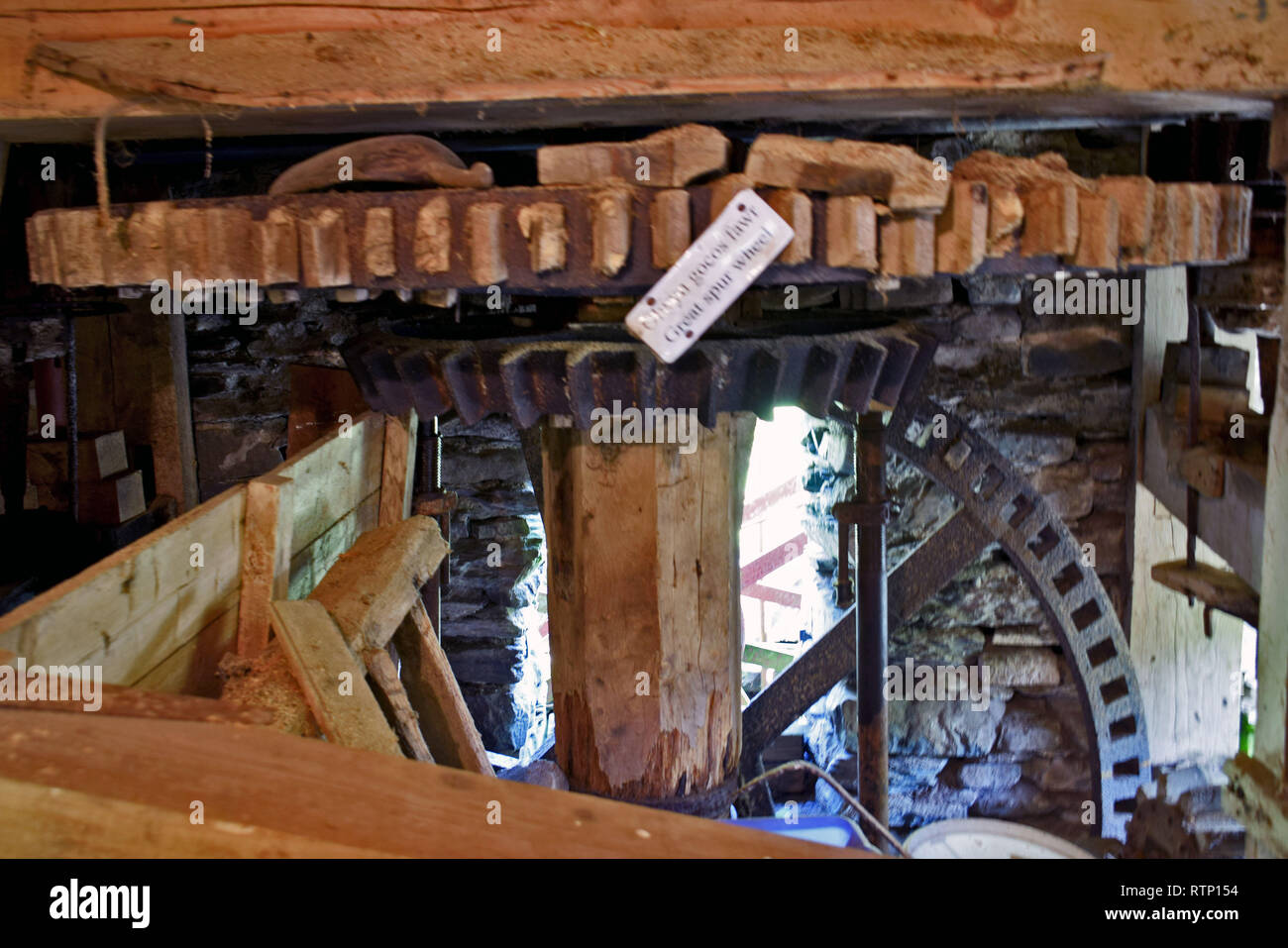 The cogs wheels in a working mill Stock Photo - Alamy