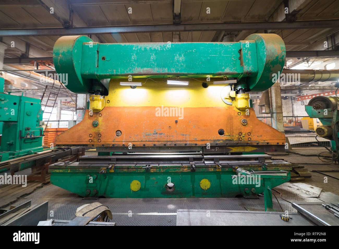 Industrial concept. A green lathe on construction site inside the ...