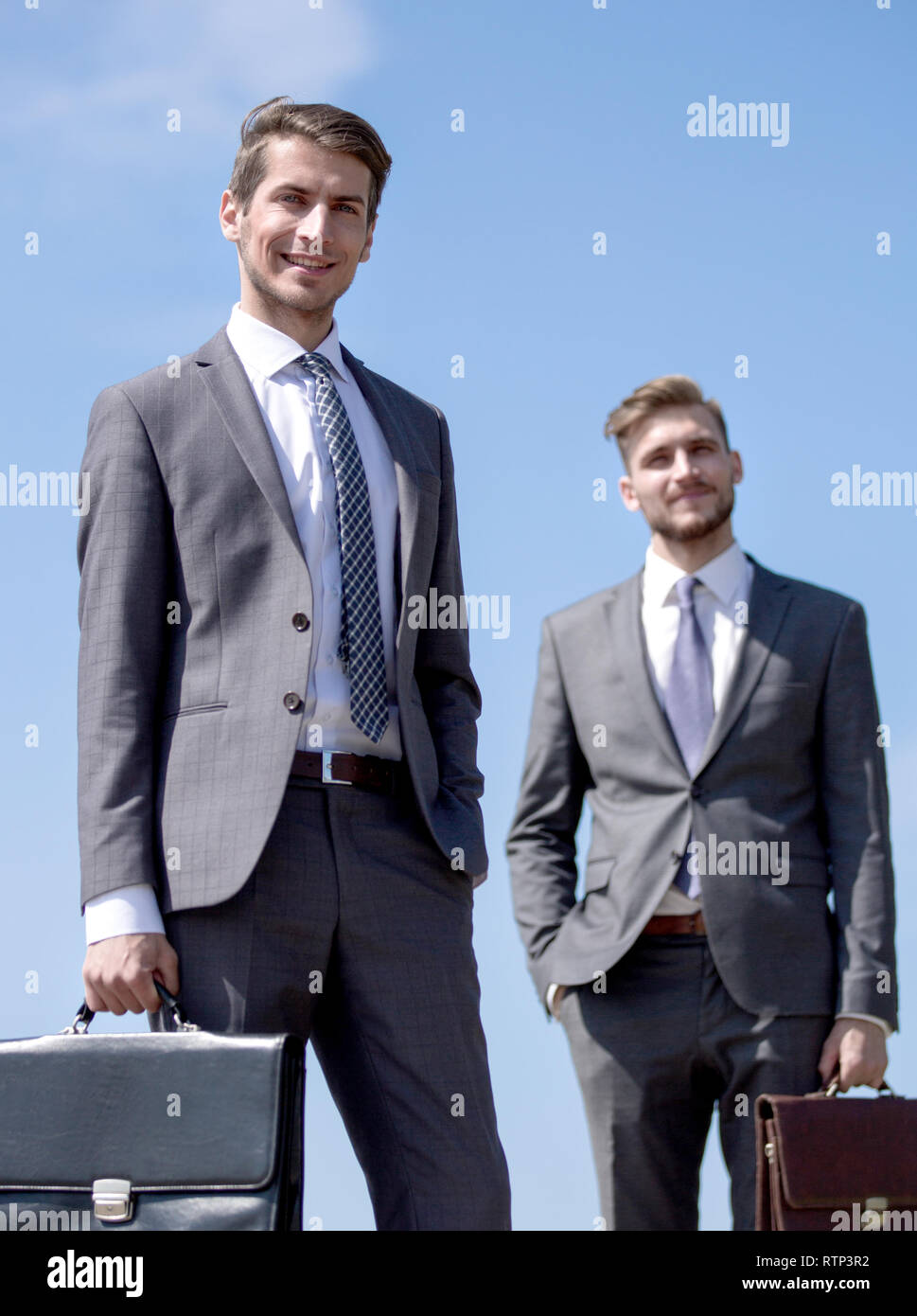 two business men with leather briefcases Stock Photo - Alamy