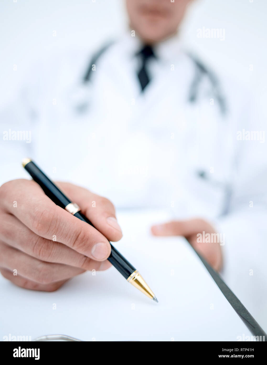background image.the doctor signing the medical report Stock Photo - Alamy