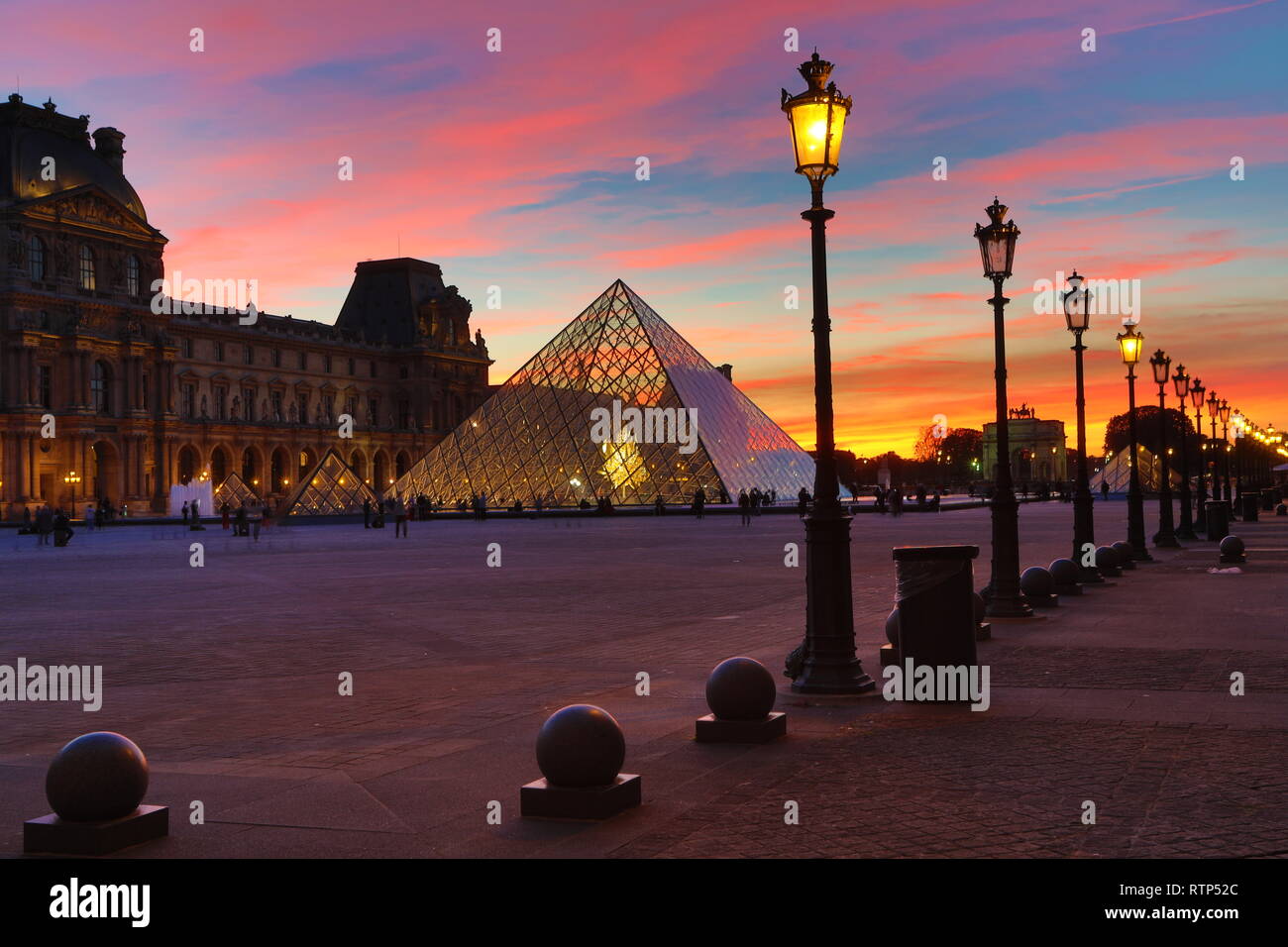 PARIS - OCTOBER 8, 2018 Louvre museum at twilight in summer. Louvre ...