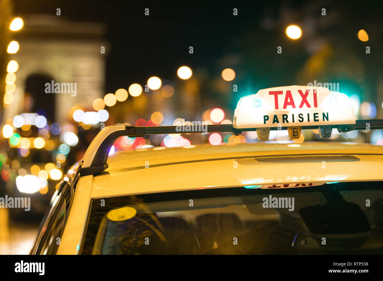 French taxi with the champs elysees avenue in background Stock Photo ...